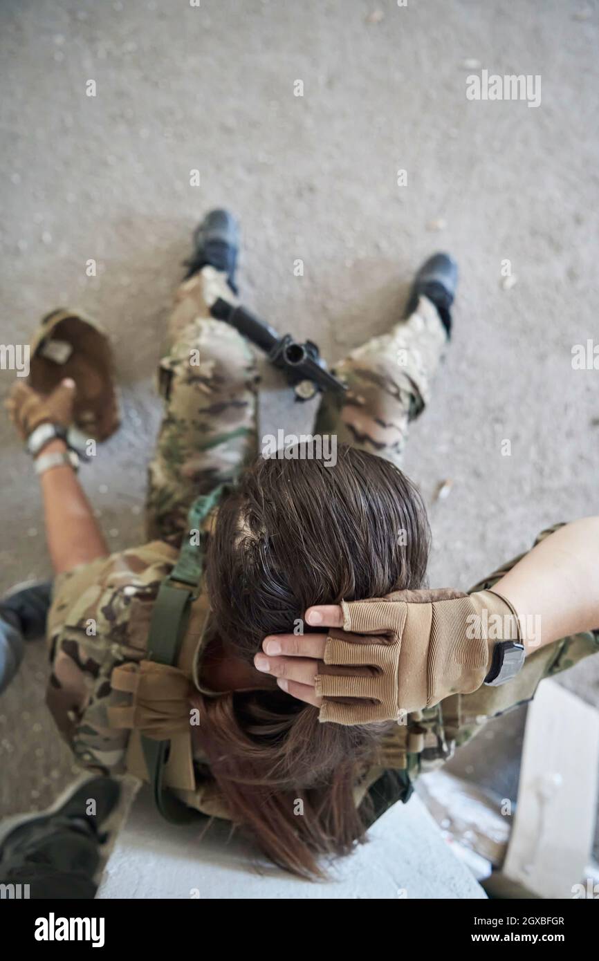 military army female soldier lady killer having a break in urban modern ...