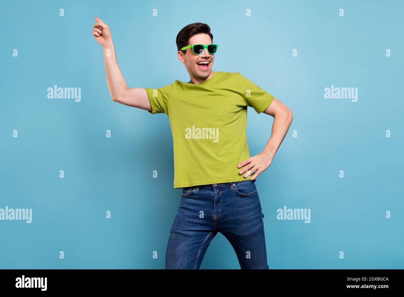 Portrait of attractive cheerful guy dancing having fun good mood ...