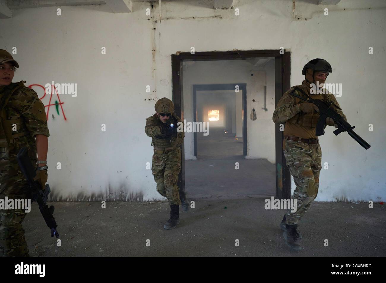 special forces soldiers team in urban environment making tactical ...