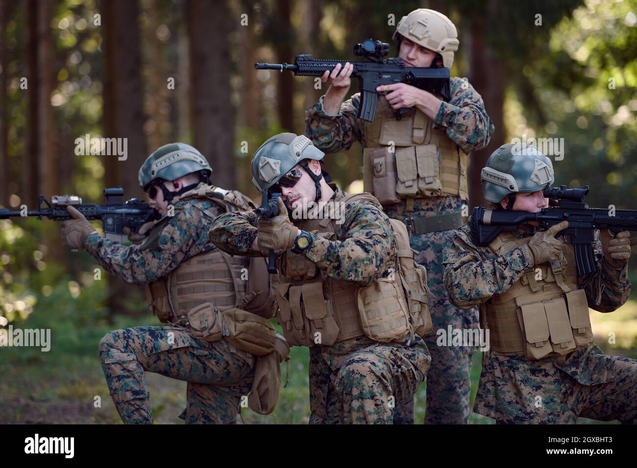 Soldier fighters standing together with guns. Group portrait of US army ...