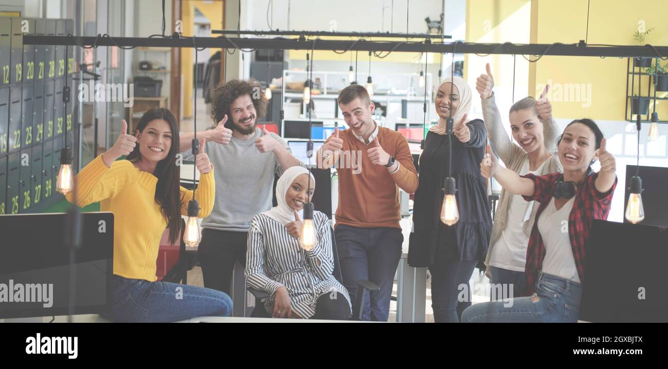 business team celebrating and have fun at modern coworking open space ...
