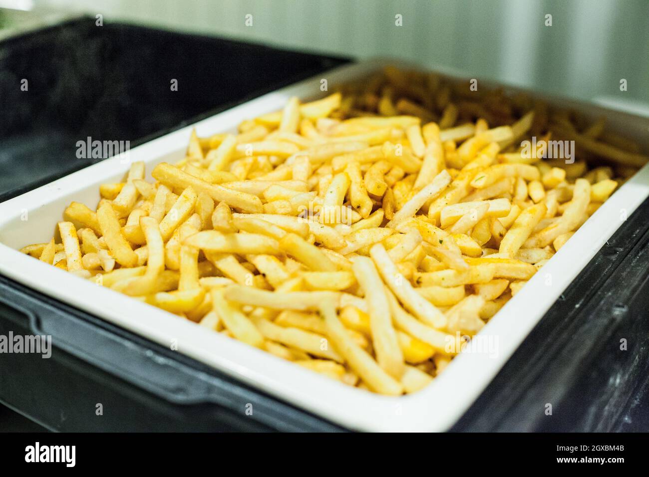 French fries served in event dish Stock Photo - Alamy