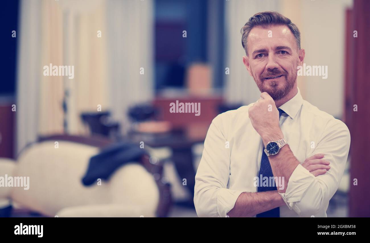 Senior executive businessman at luxury corporate workspace. Portrait of ...