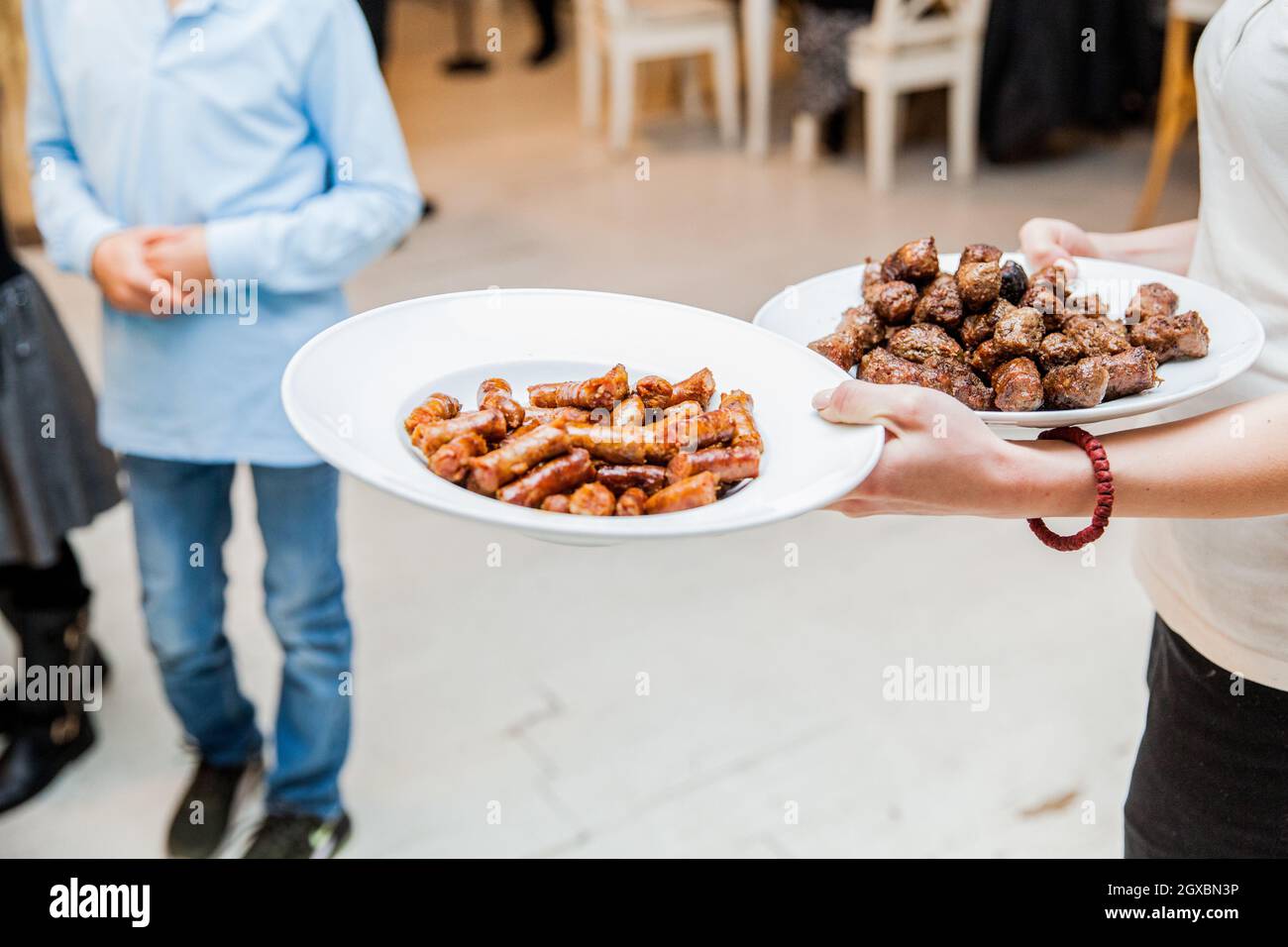 Tasty mixed grilled meat serving on event dish at the party in the ...