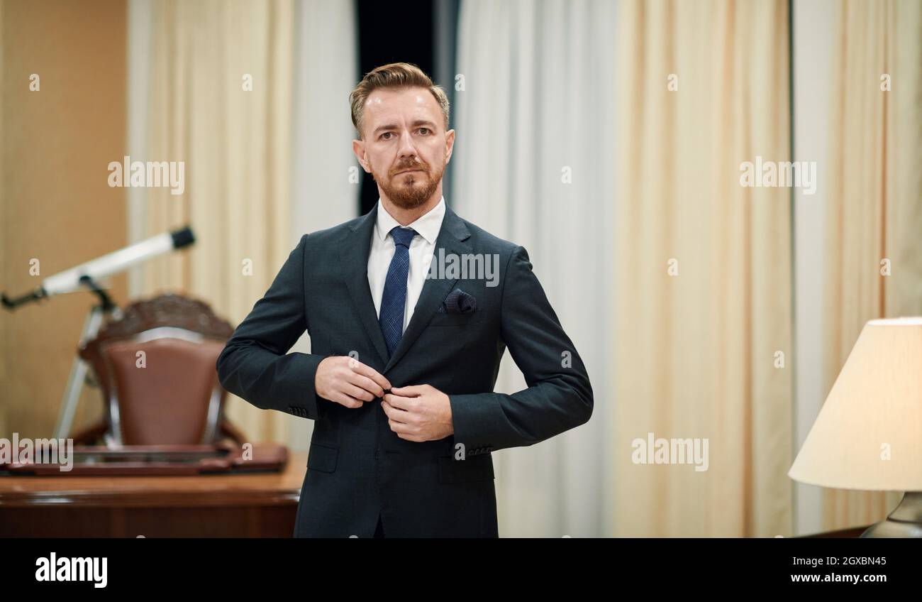 Senior executive businessman at luxury corporate workspace. Portrait of ...