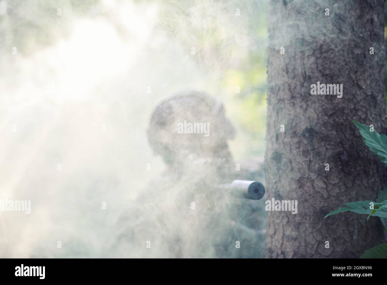 modern warfare soldier in action aiming at weapon laser sight optics in ...