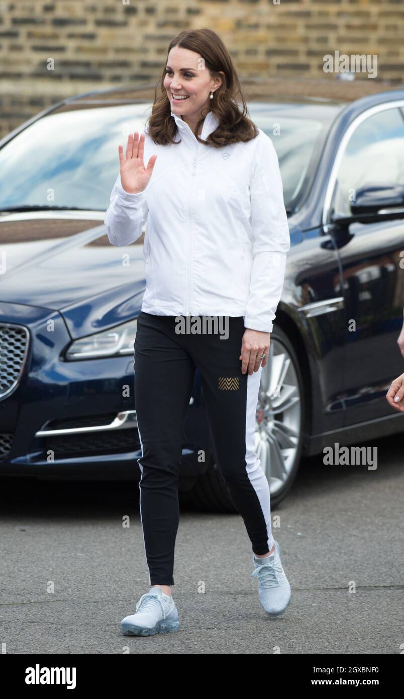 Catherine, Duchess of Cambridge, wearing a black and white tracksuit ...