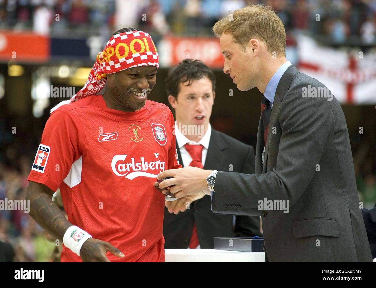 Prince William presents Liverpool player Djibril Cisse with his winners ...