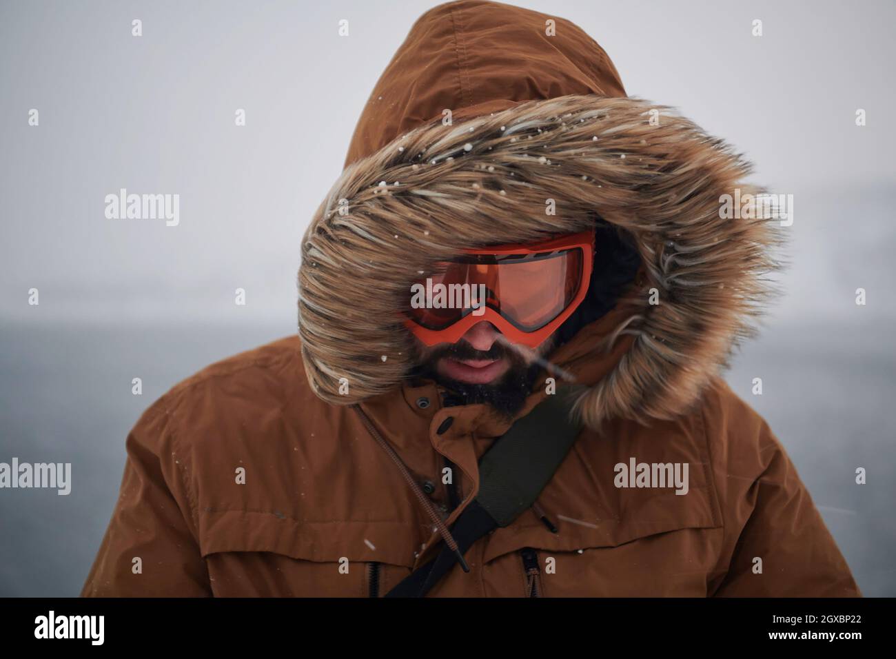 portrait local authentic eskimo man at winter in stormy weather wearing ...