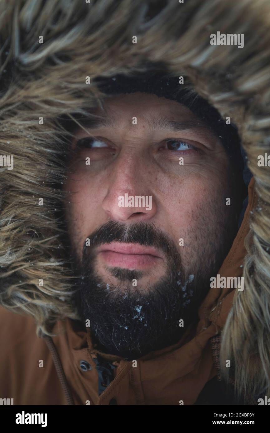 portrait local authentic eskimo man at winter in stormy weather wearing ...