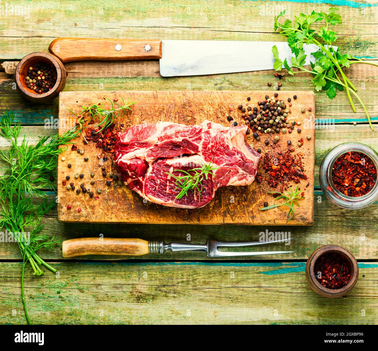 Raw beef meat with rosemary and spices.Uncooked beef steak Stock Photo ...