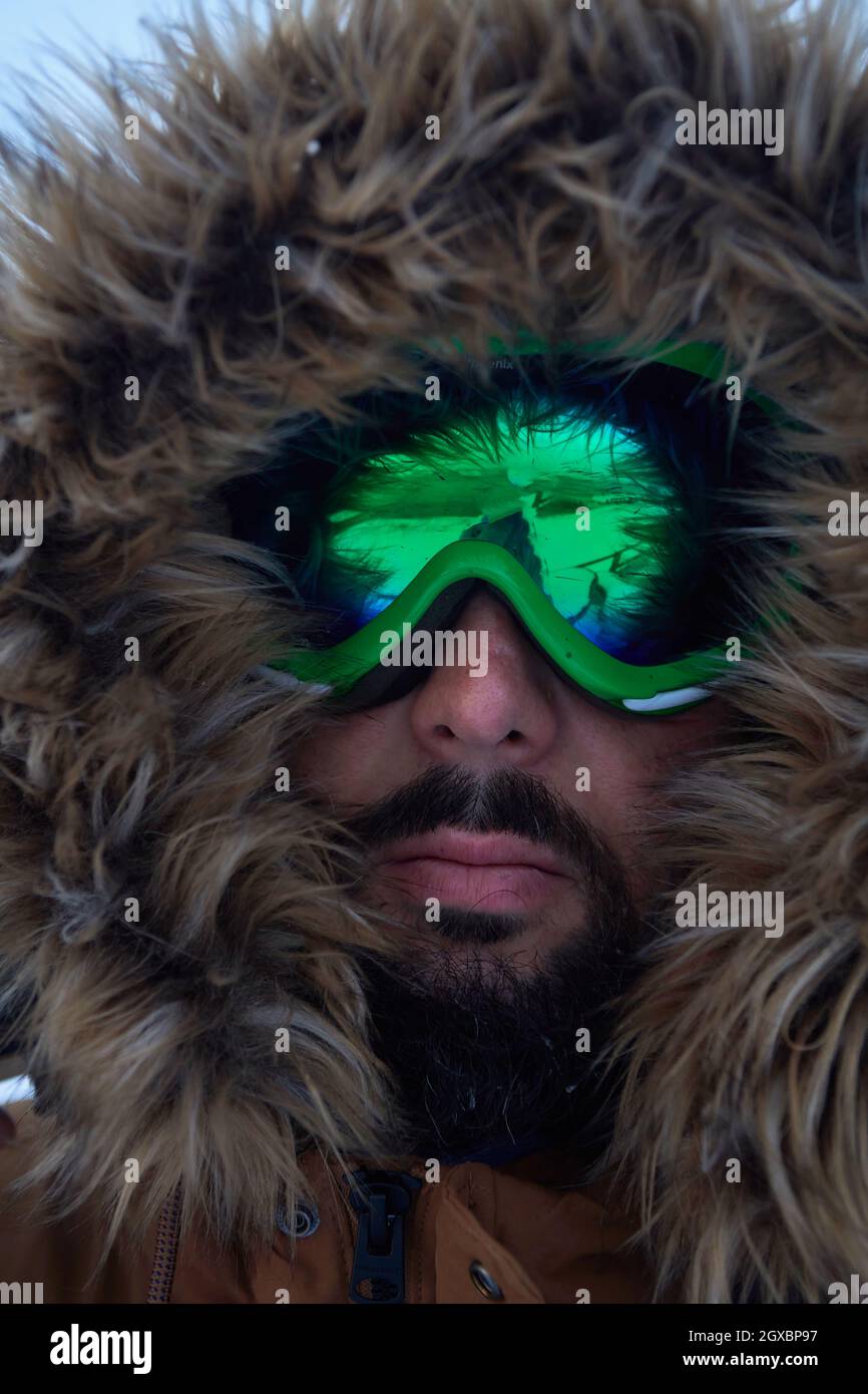 portrait local authentic eskimo man at winter in stormy weather wearing ...