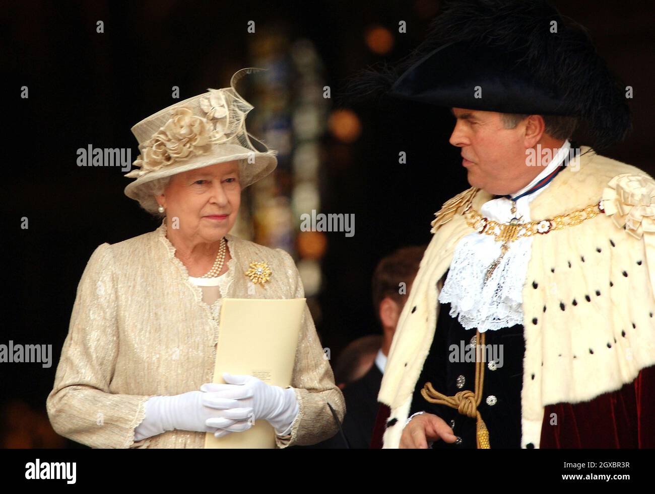 Queen Elizabeth ll, accompanied by the Lord Mayor of London, leaves St ...