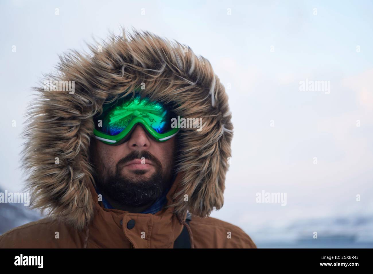 portrait local authentic eskimo man at winter in stormy weather wearing ...