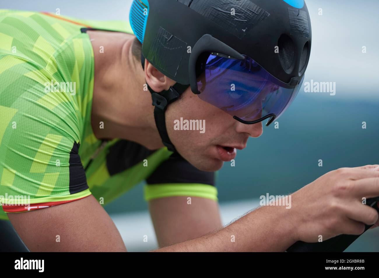 triathlon athlete riding racing bike on morning training urban ...