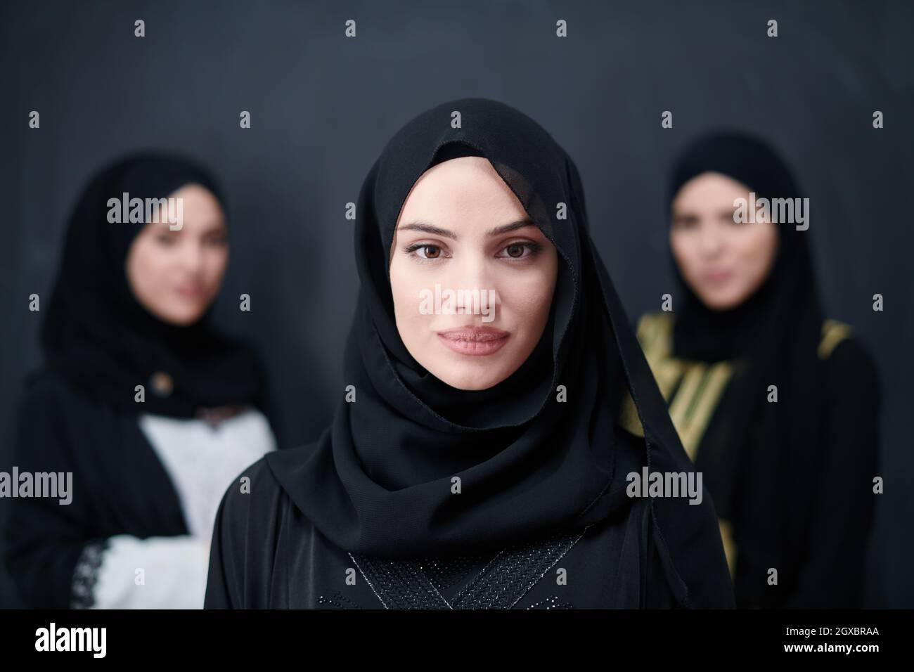 group portrait of beautiful muslim women in fashionable dress with ...