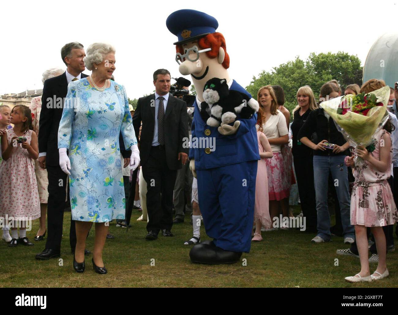 Queen Elizabeth II meets Postman Pat Stock Photo - Alamy
