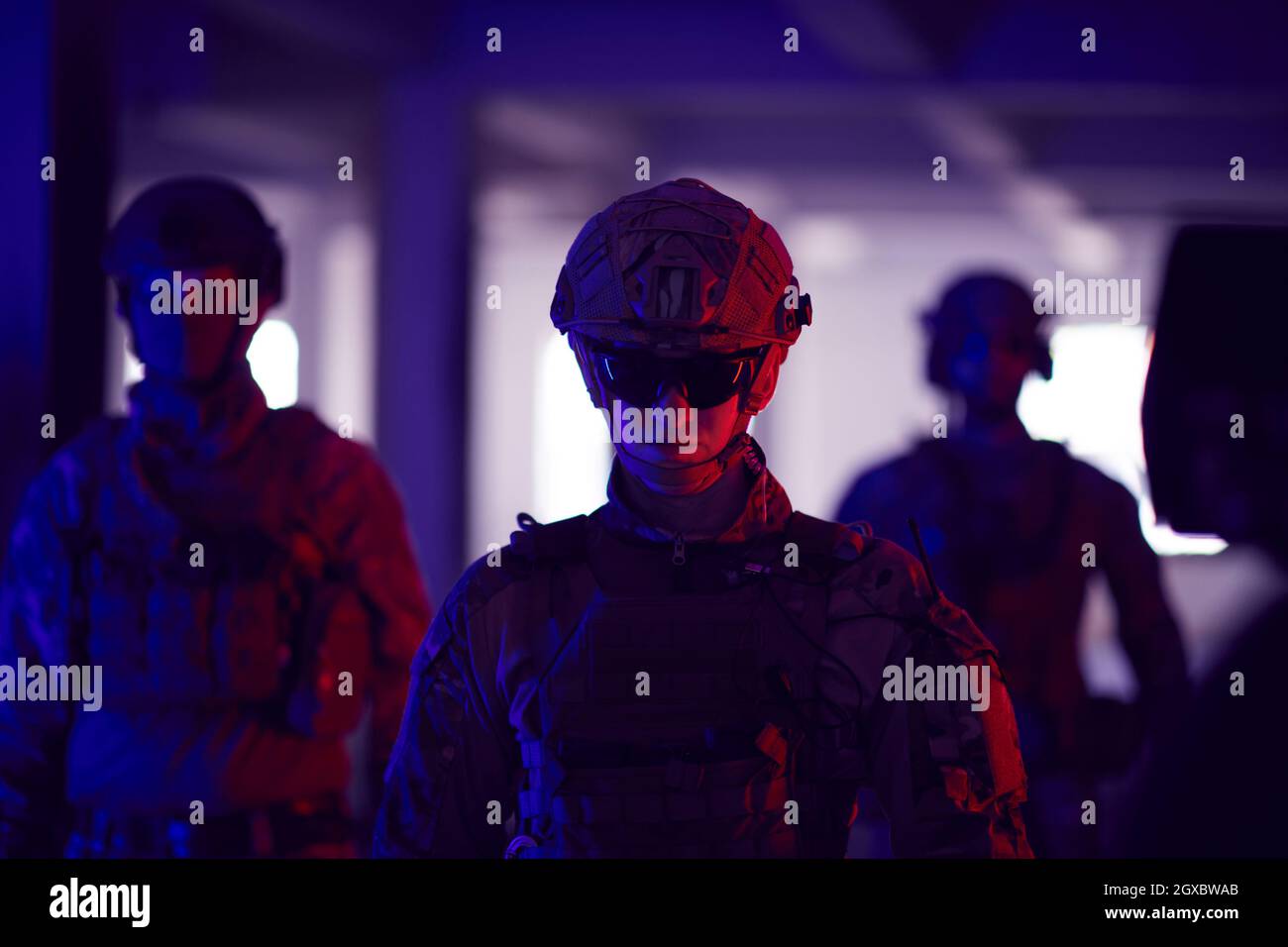 soldier squad team walking in urban environment colored neon lights ...