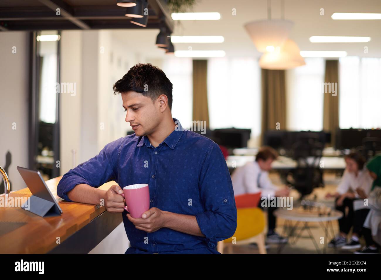 Indian business people drinking tea hi-res stock photography and images ...