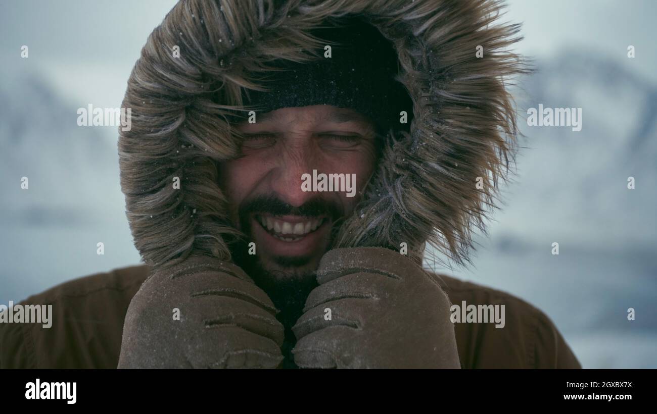 portrait local authentic eskimo man at winter in stormy weather wearing ...