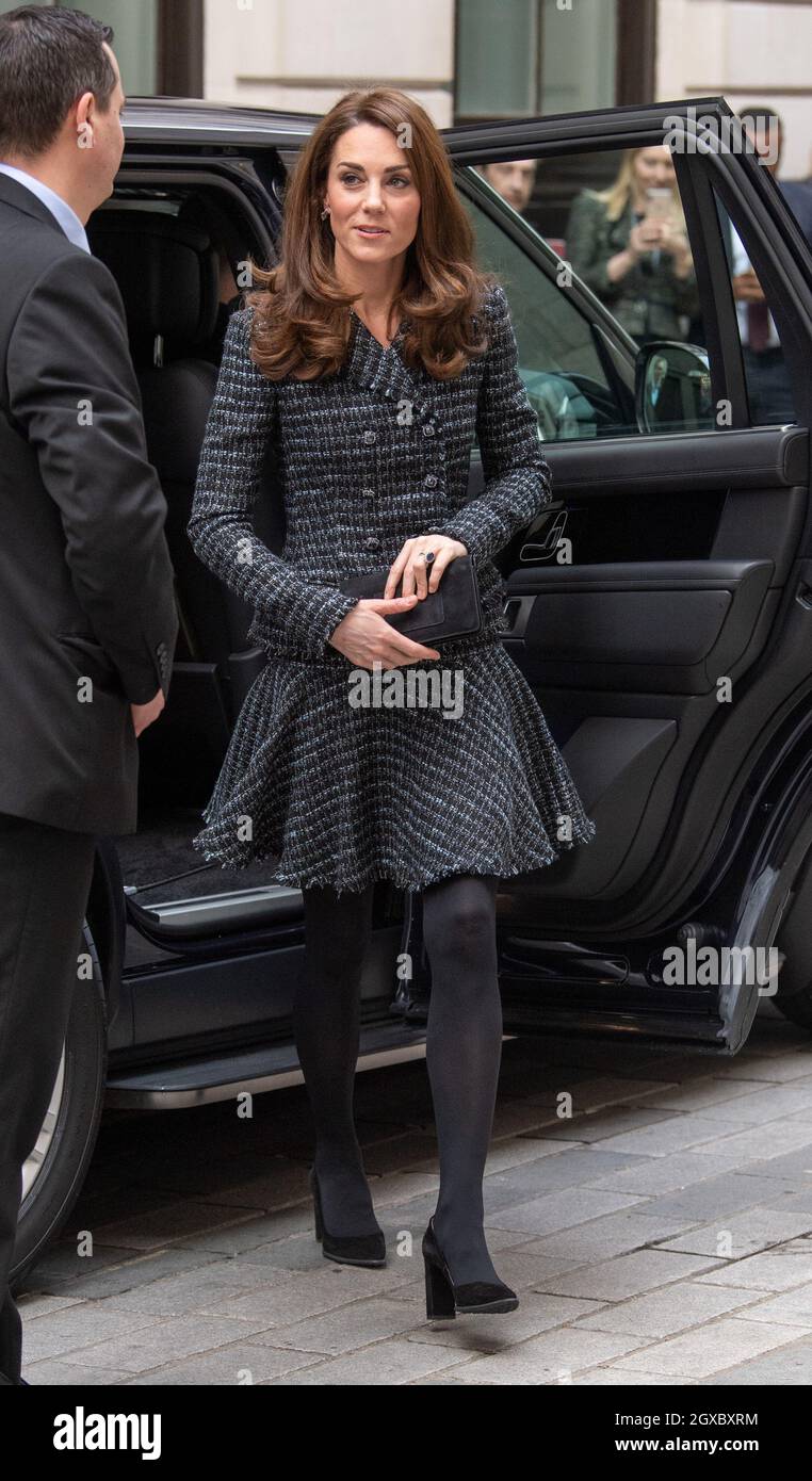 The Duchess of Cambridge, wearing a chic tweed suit and black tights ...