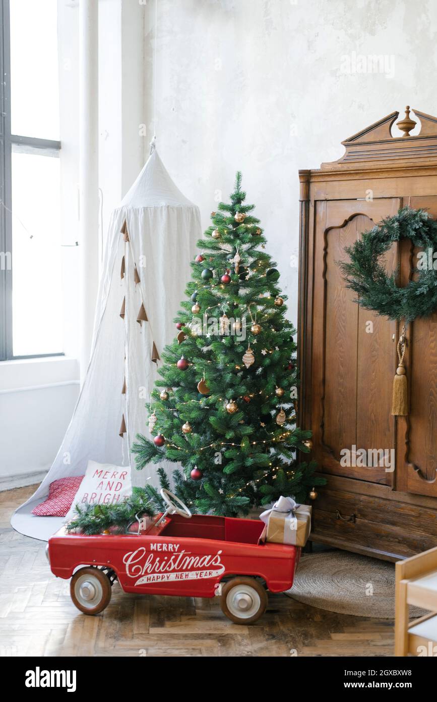 Christmas tree, wooden vintage cabinet, children's toy car, teepee or ...