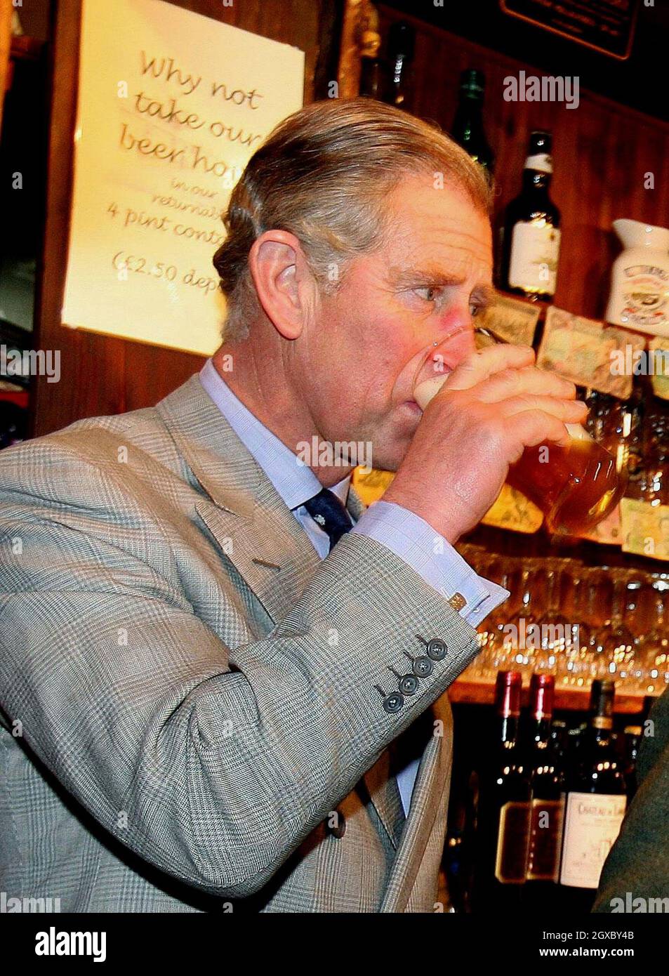 Prince Charles, Prince of Wales drinks a pint in the Holly Bush, a ...