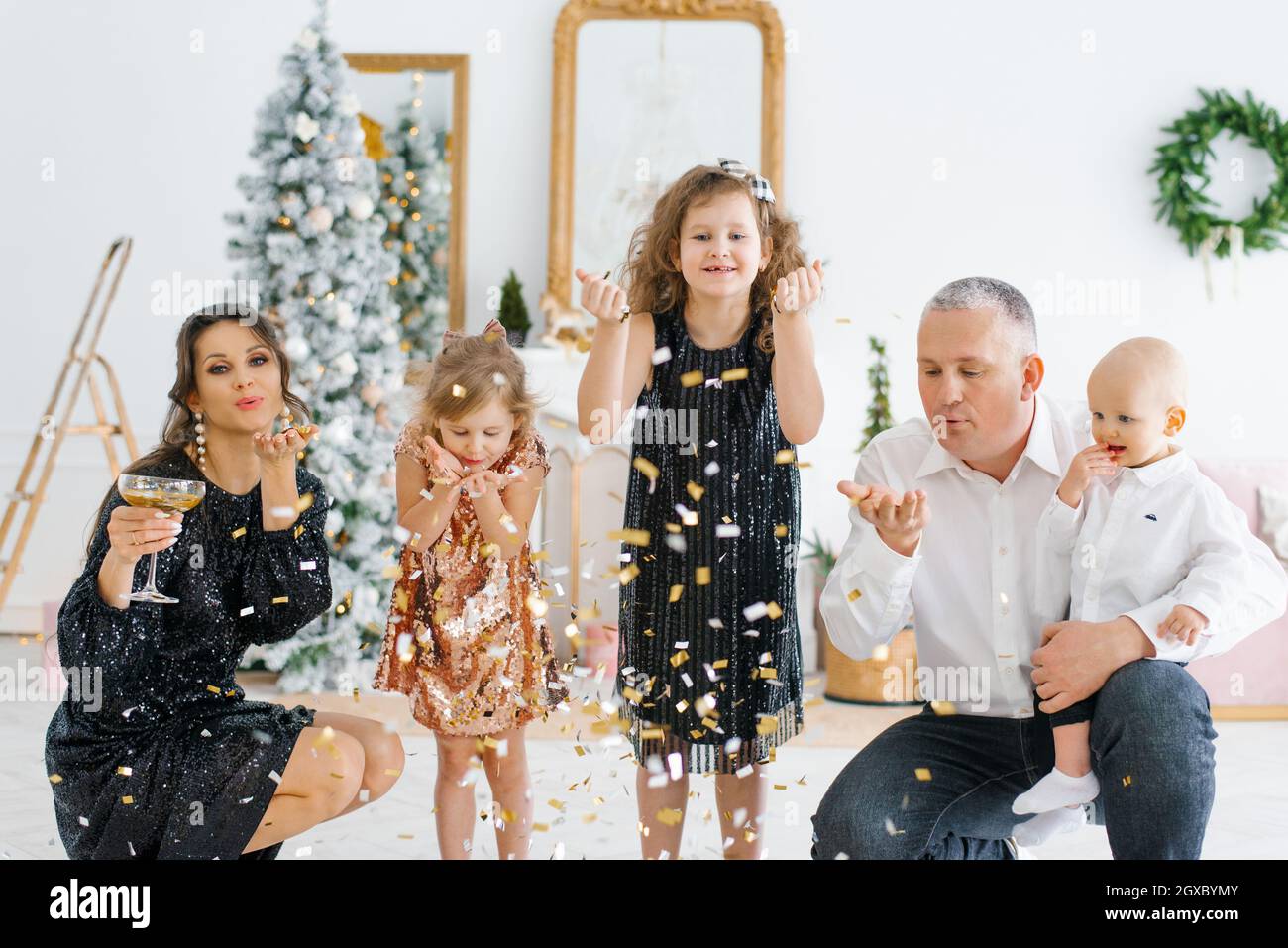 A European young family, dad, mom, son and little girls-daughters are ...