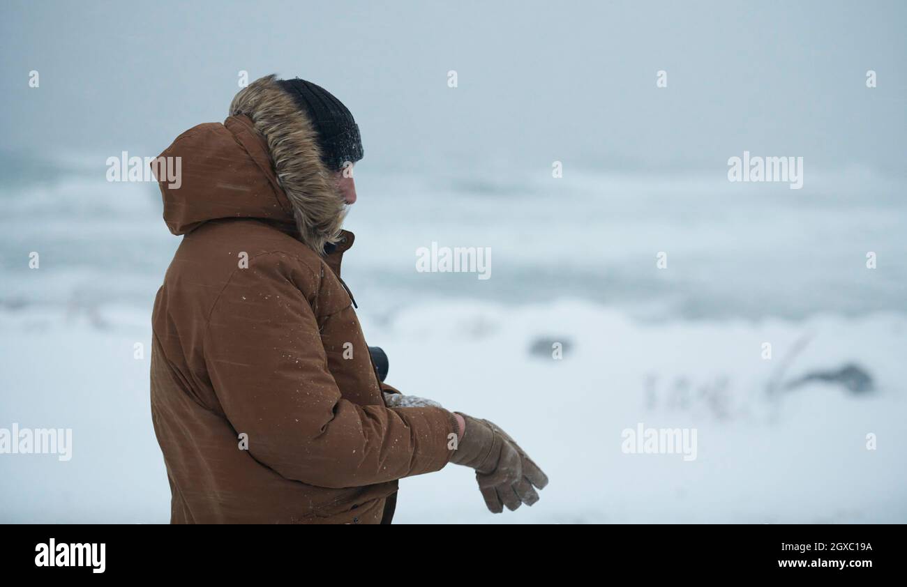 portrait local authentic eskimo man at winter in stormy weather wearing ...
