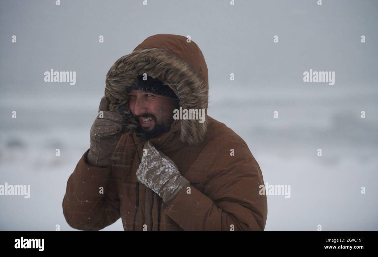 portrait local authentic eskimo man at winter in stormy weather wearing ...
