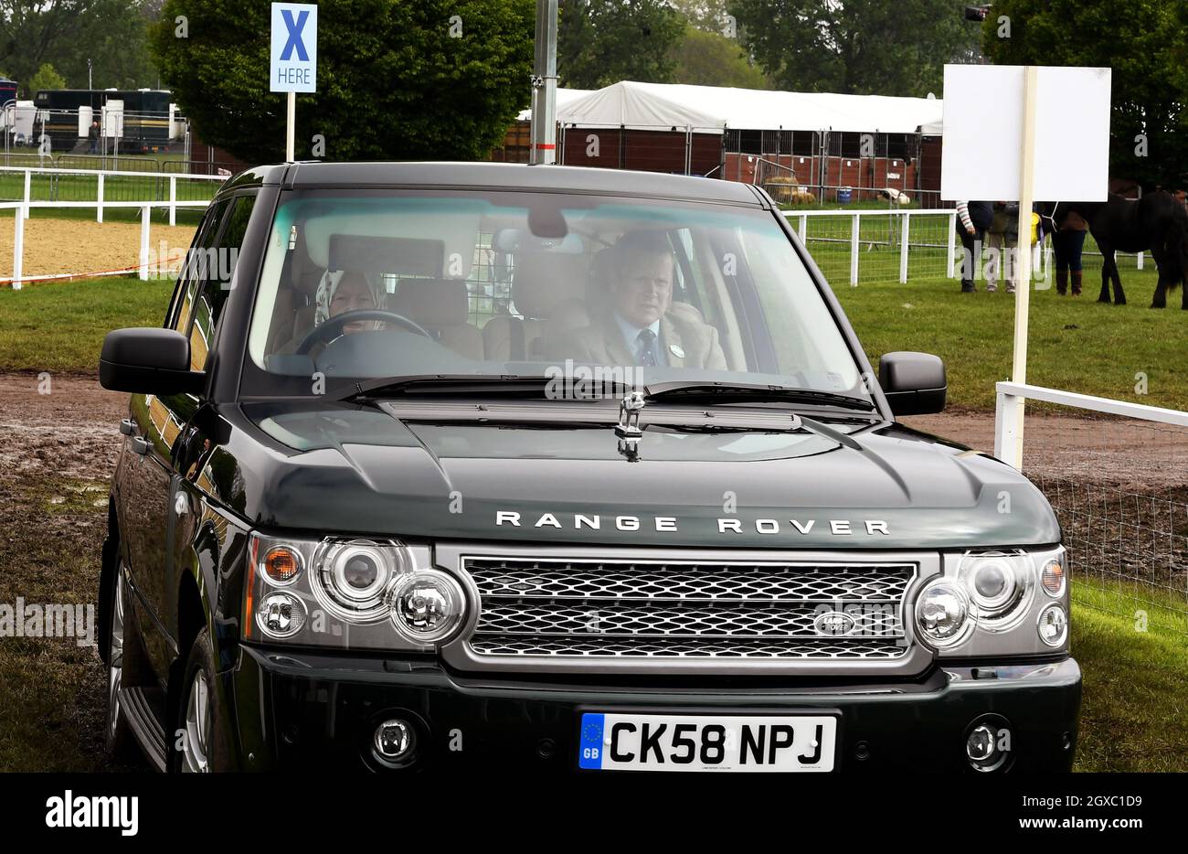 Queen Elizabeth arrives driving a Range Rover to attend the Royal ...