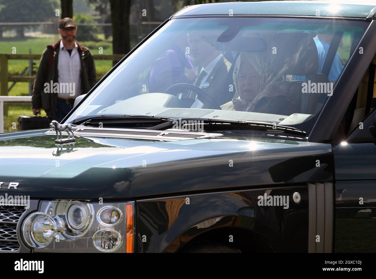 Queen Elizabeth arrives driving a Range Rover to attend the Royal ...
