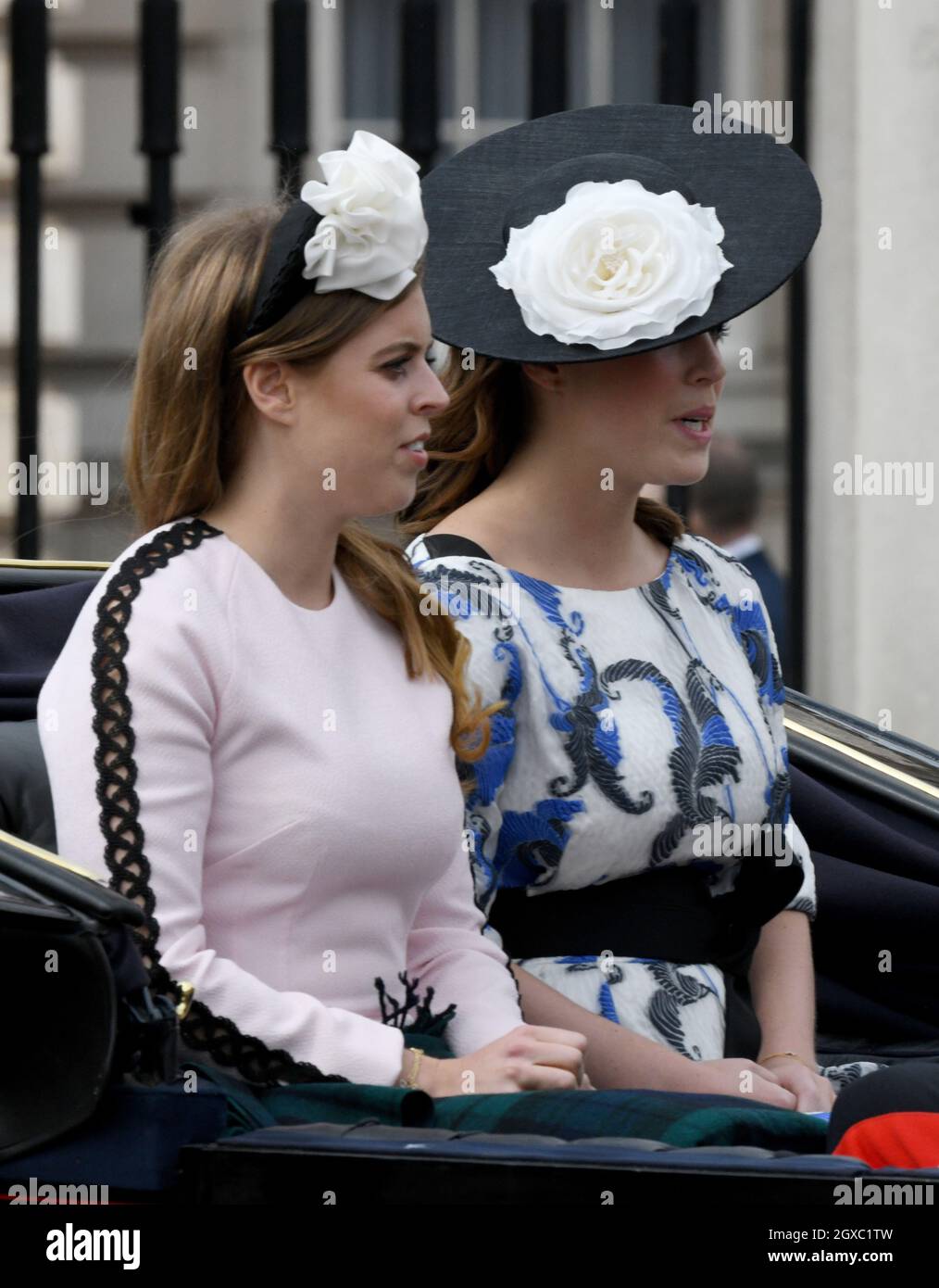 Princess Beatrice and Princess Eugenie ride in an open carriage during ...