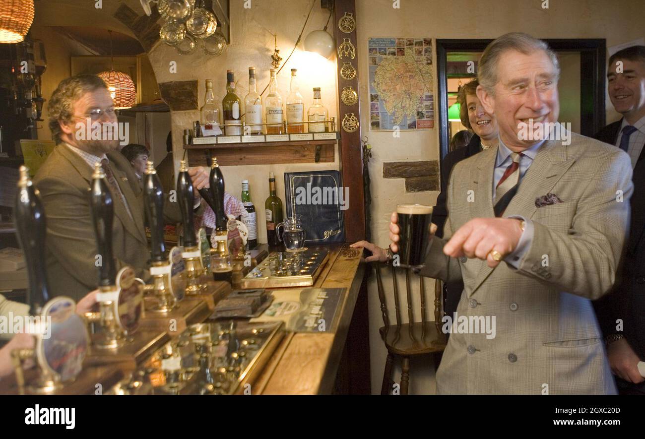 Prince Charles, Prince of Wales enjoys a beer at the Old Crown pub and ...