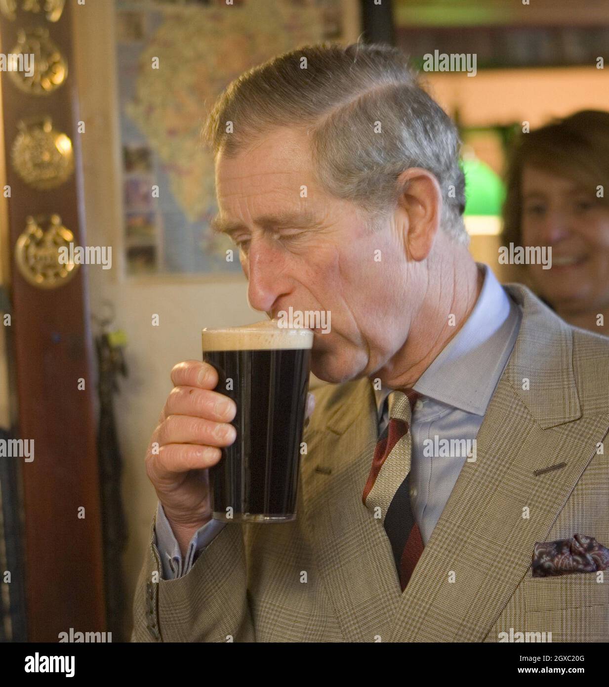 Prince Charles, Prince of Wales enjoys a beer at the Old Crown pub and ...