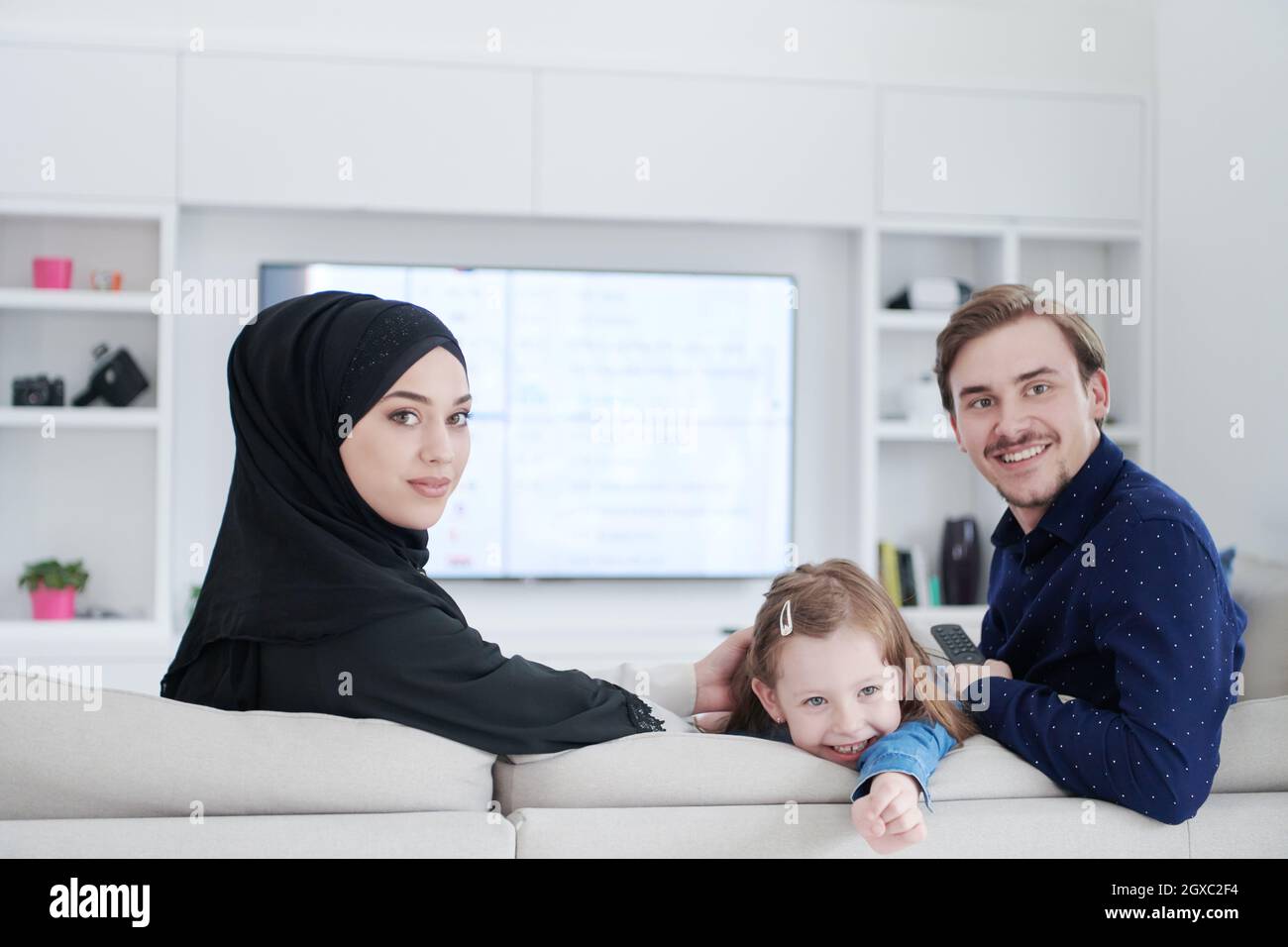 Happy Muslim family with daughter woman in traditional fashionable ...