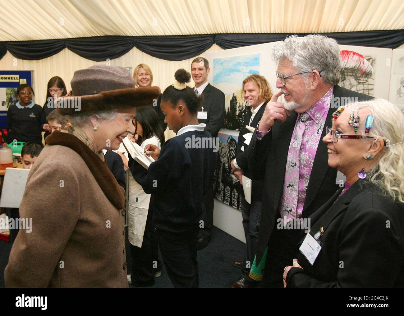 Queen Elizabeth II smiles as she meets artist Rolf Harris and wife ...