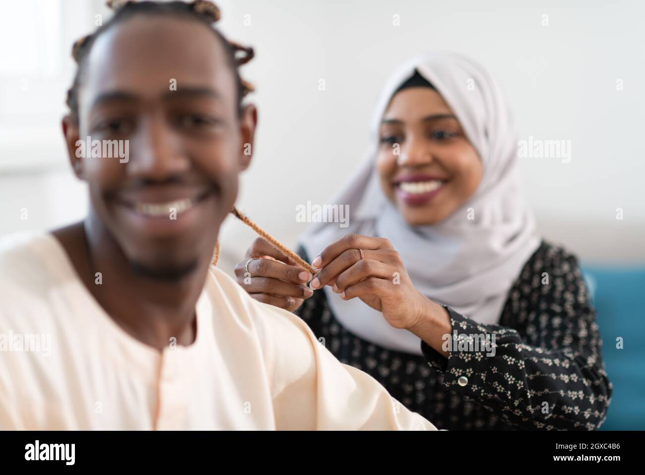 young afro muslim couple have romantic time at home while woman making ...