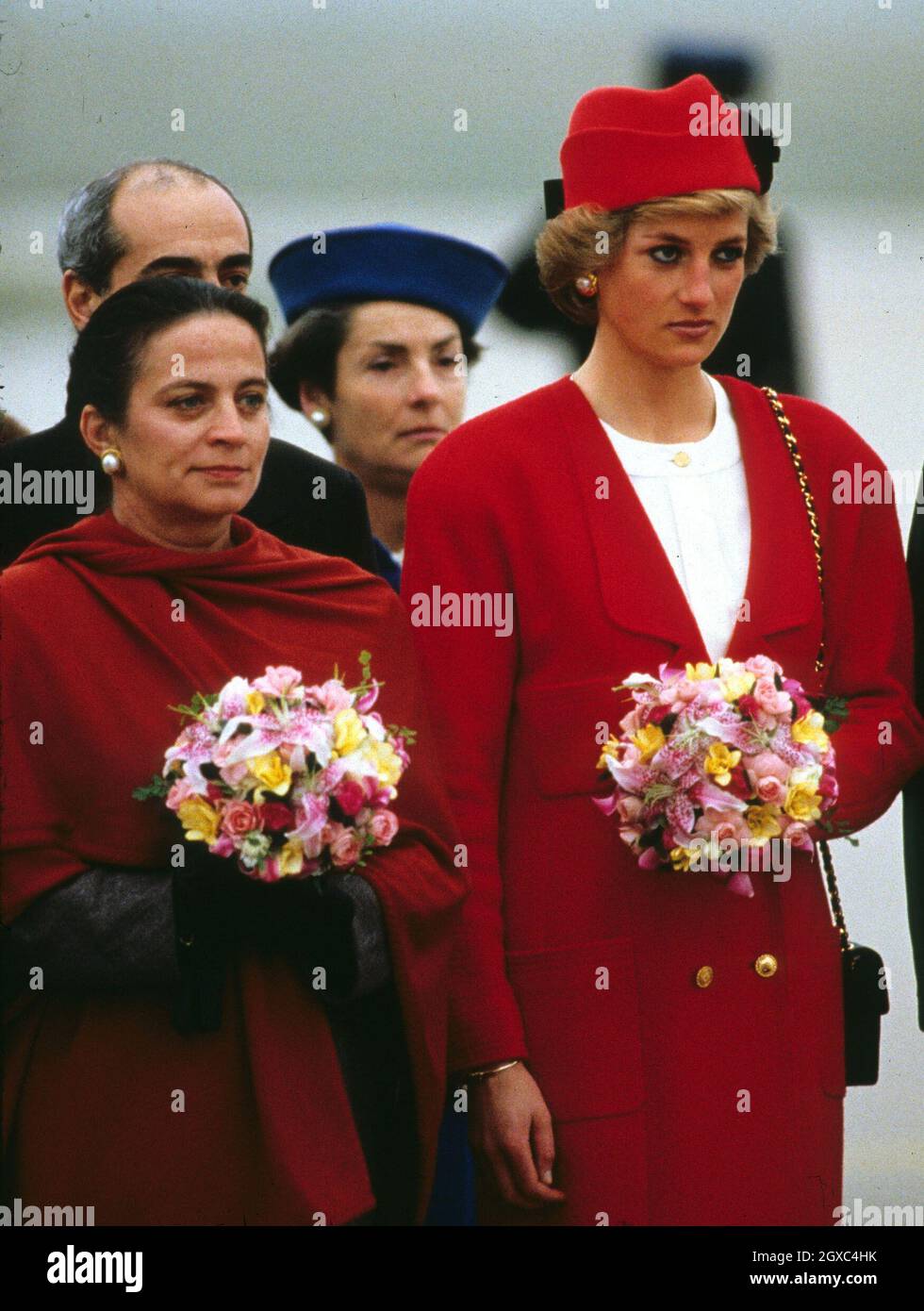 Diana, Princess of Wales, wearing a scarlet Chanel suit, arrives in ...