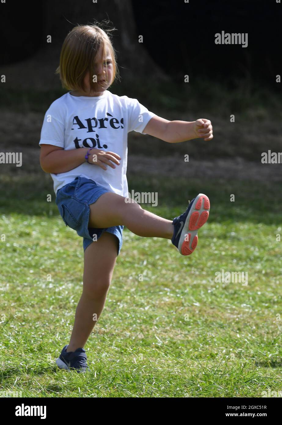 Mia Tindall kicks a football during the Gatcombe Horse Trials at ...