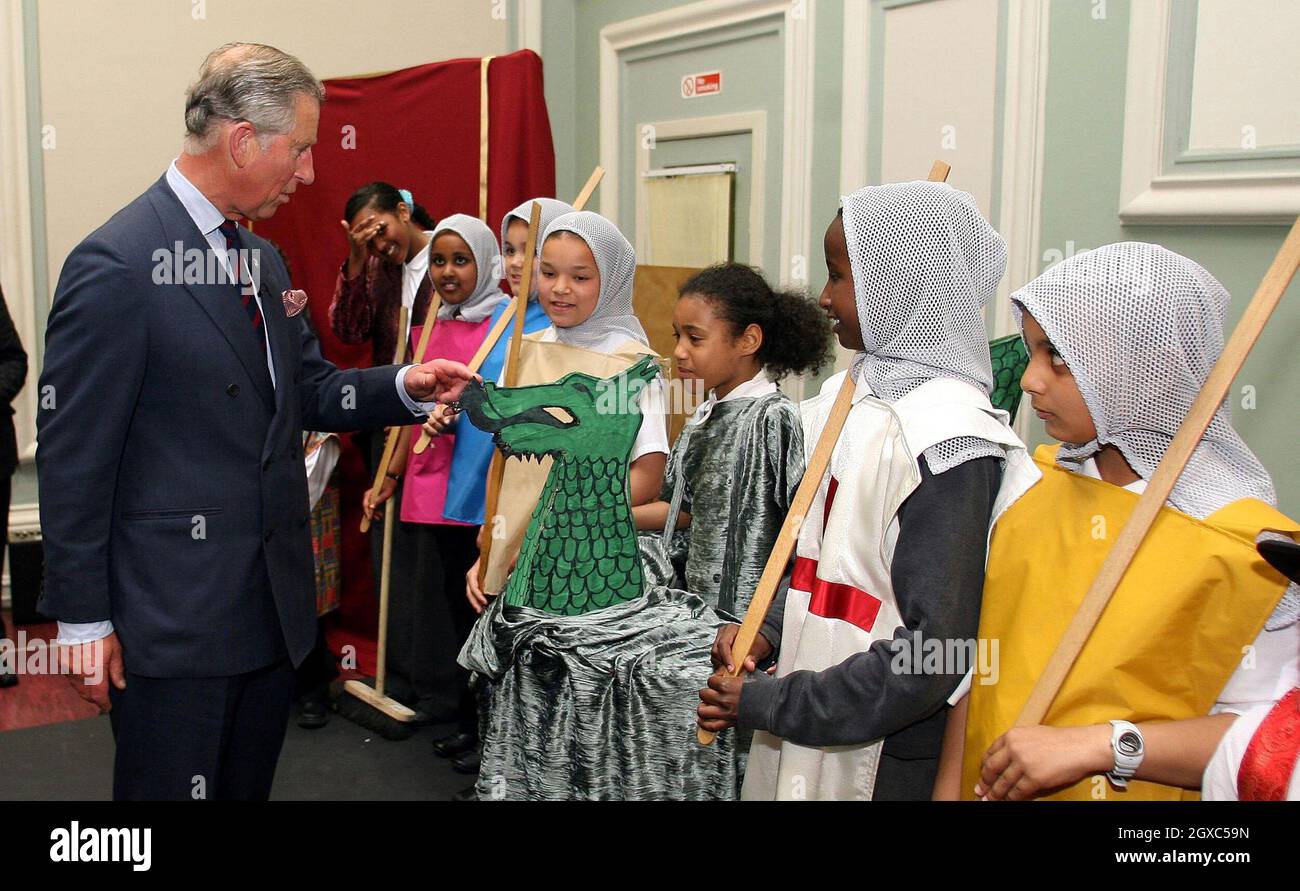 Prince Charles, Prince of Wales, meets members of the cast of a Mummers ...