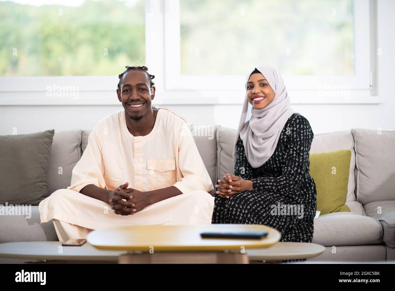 african muslim couple at home in ramadan reading quran holly islam book ...