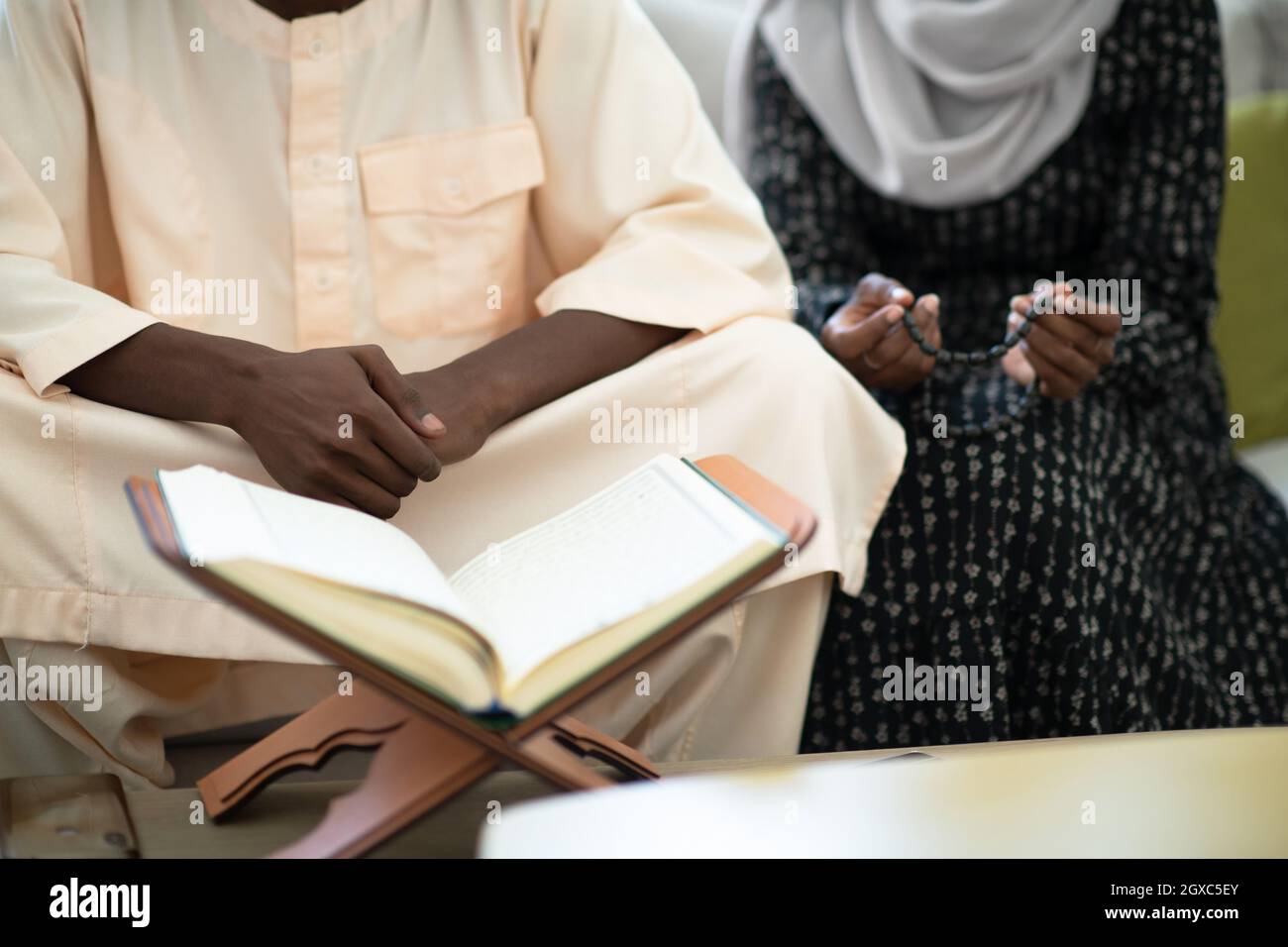 african muslim couple at home in ramadan reading quran holly islam book ...