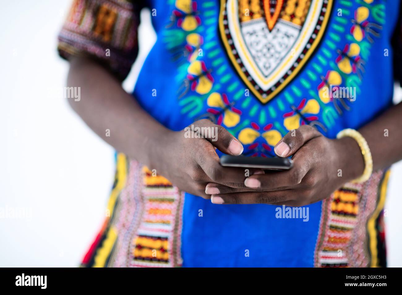native sudan african male using smart phone isolated on white ...