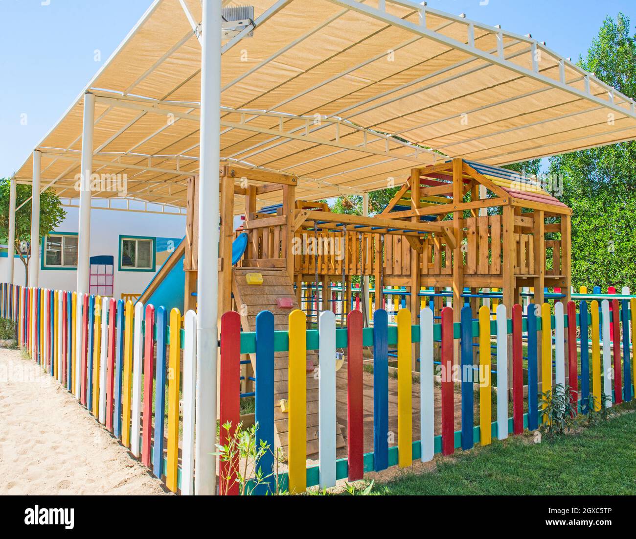Large wooden climbing frame structure in children's playground area of ...