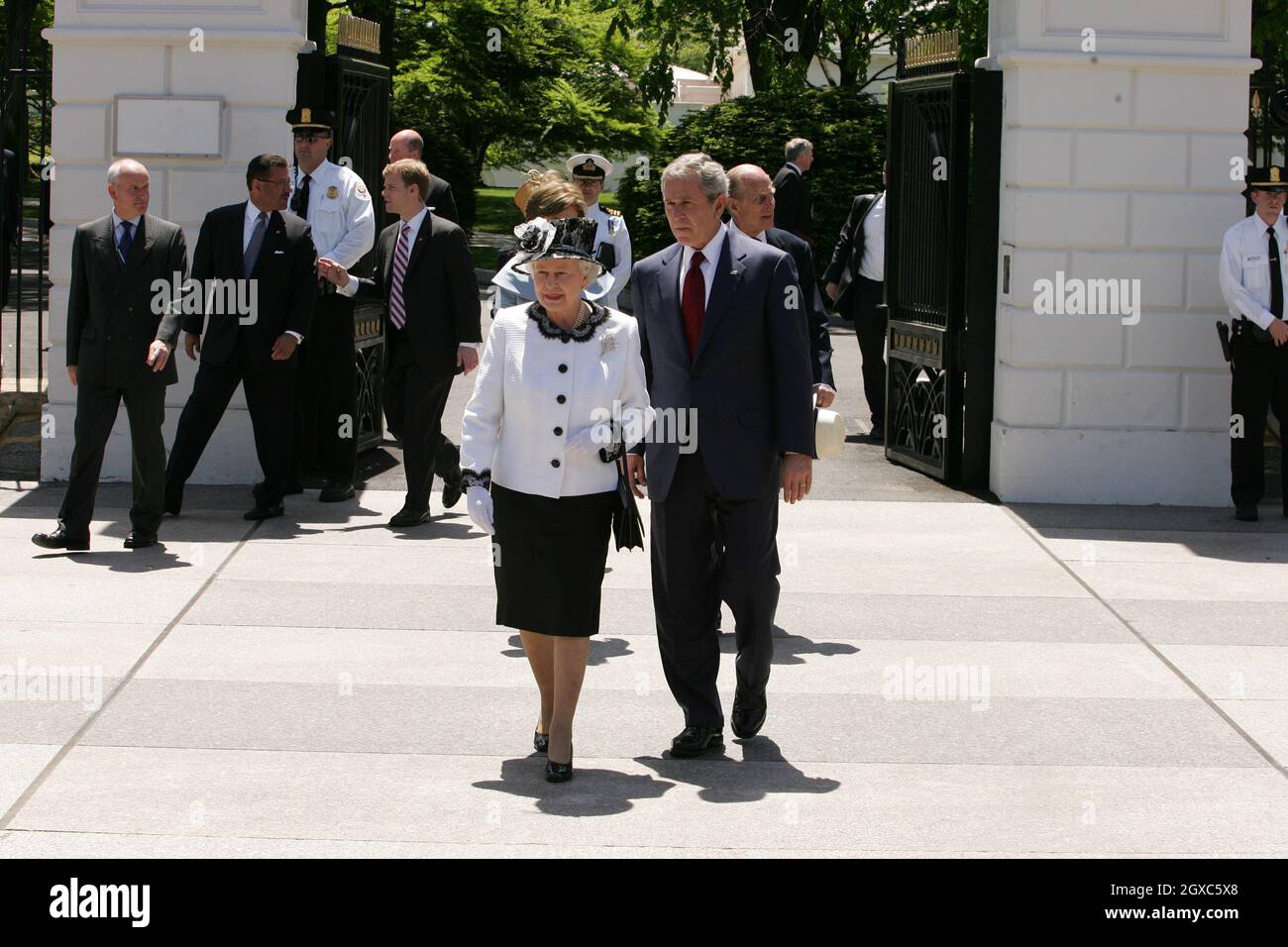 Queen Elizabeth II and Prince Philip, Duke of Edinburgh walk with ...
