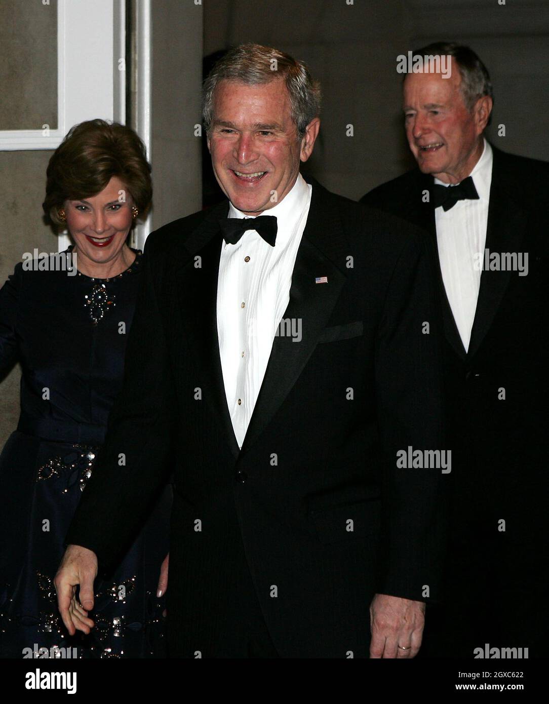 US President George W. Bush with his wife Laura and father, former US ...