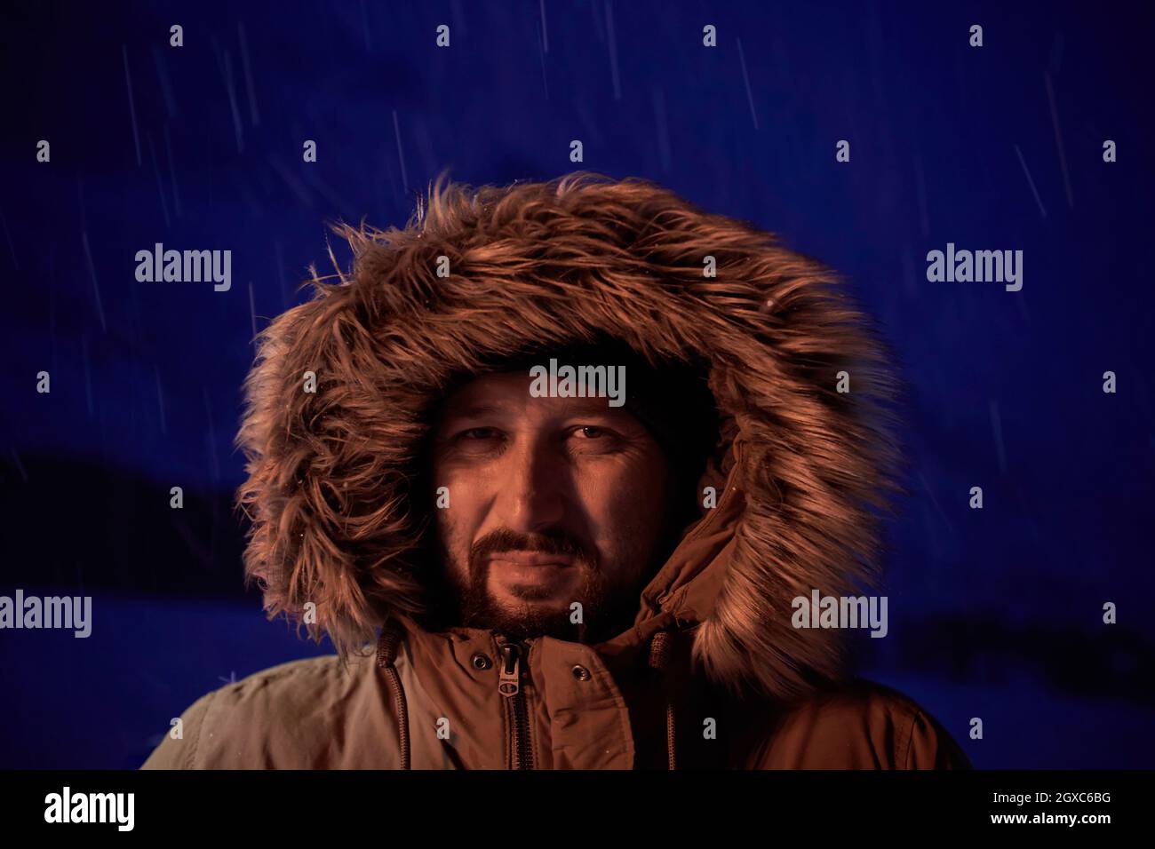 portrait local authentic eskimo man at winter in stormy weather wearing ...