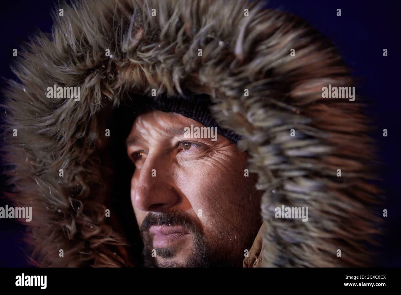 portrait local authentic eskimo man at winter in stormy weather wearing ...