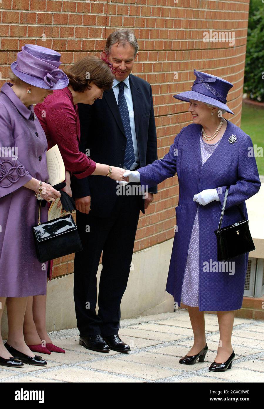 Queen Elizabeth ll shakes hands with Cherie Blair following a memorial ...